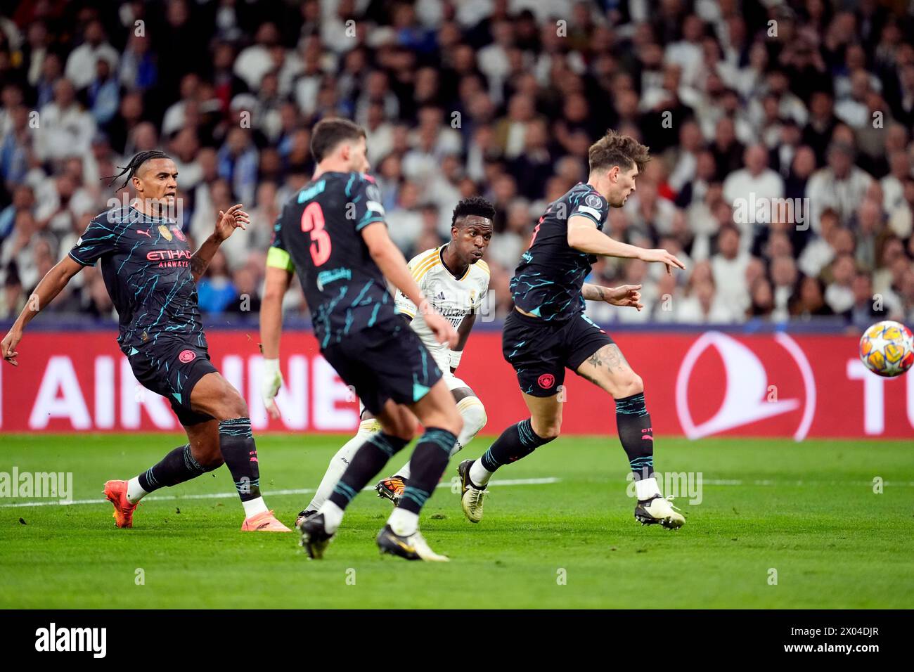 Real Madrid's Vinicius Junior runs at the Manchester City defense ...