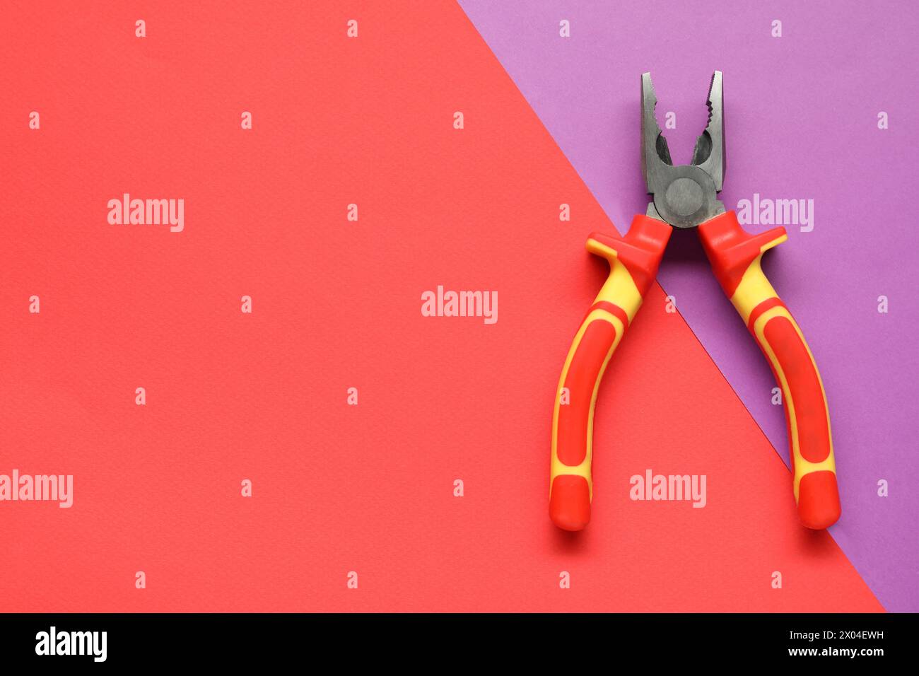 Combination pliers on color background, top view. Space for text Stock ...