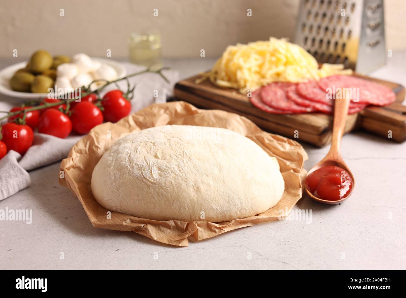Pizza dough and products on gray textured table, closeup Stock Photo ...