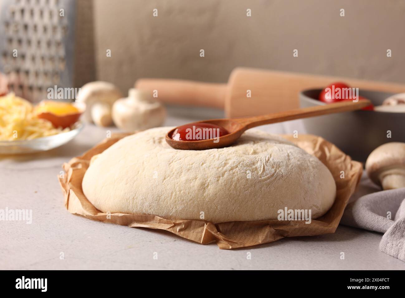 Pizza dough and products on gray textured table, closeup Stock Photo ...