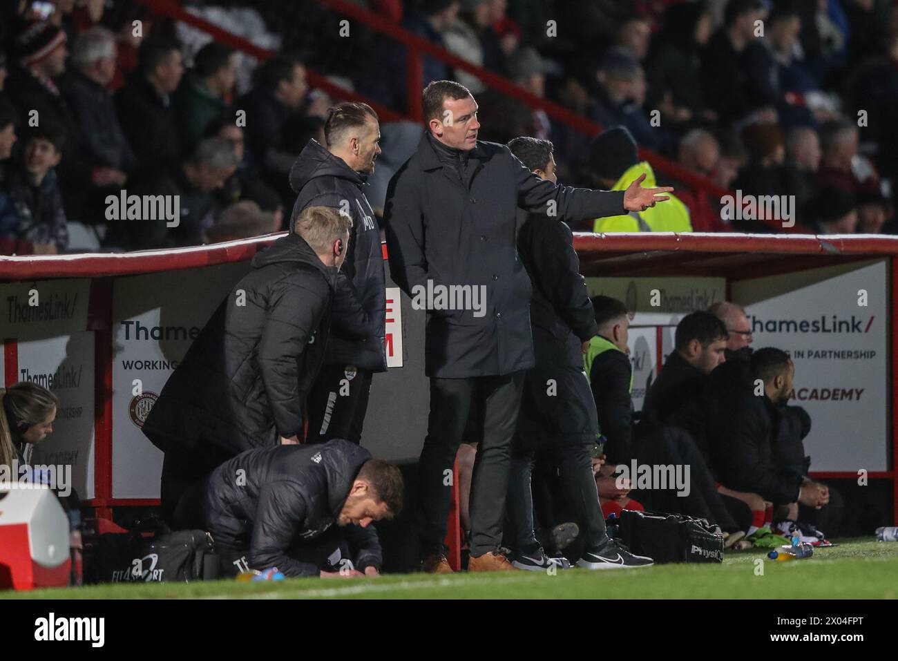 Neill Collins Head coach of Barnsley speaks to Martin Devaney first ...