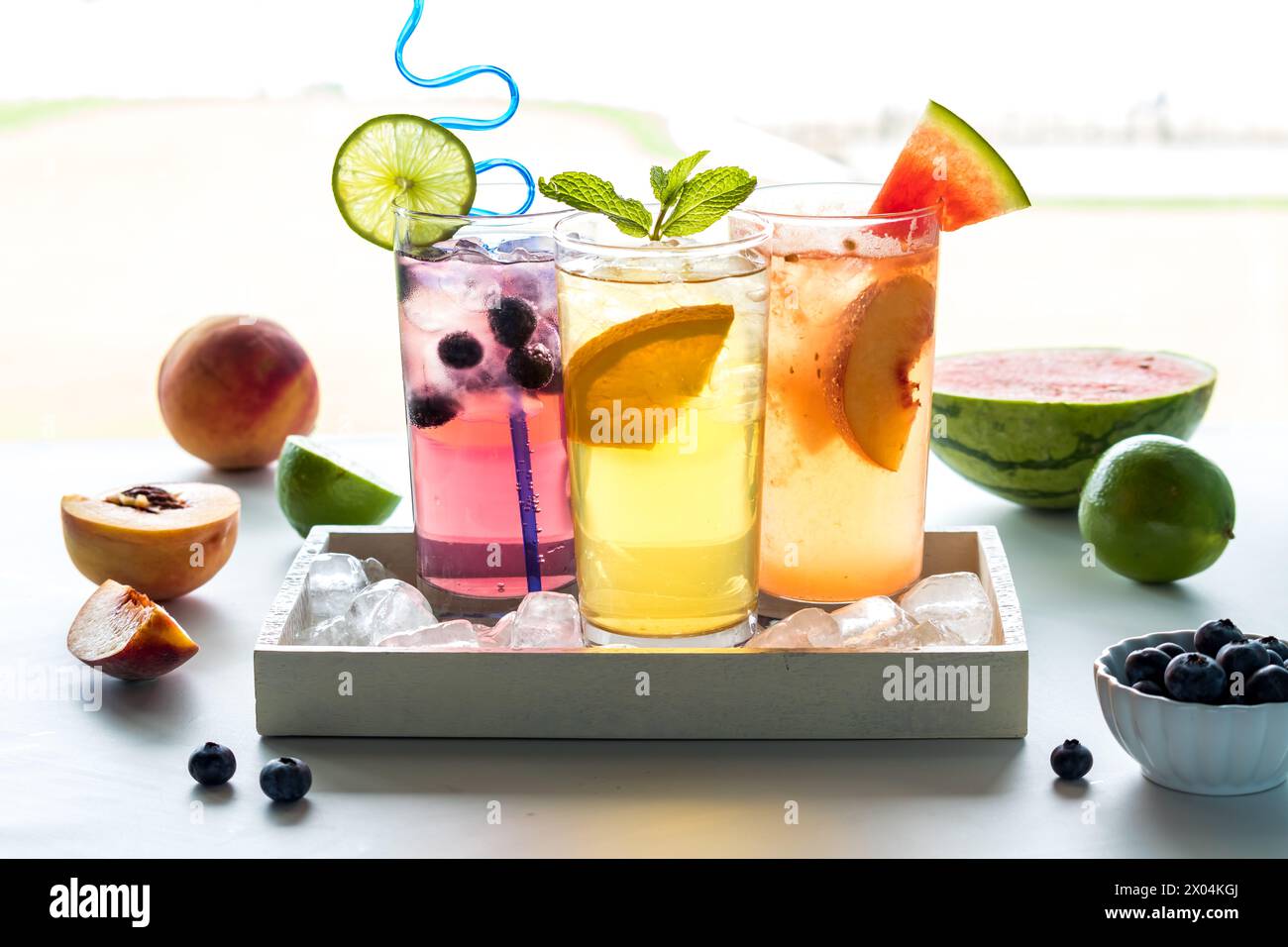 An ice filled tray of fruit flavoured seltzer waters ready for drinking ...