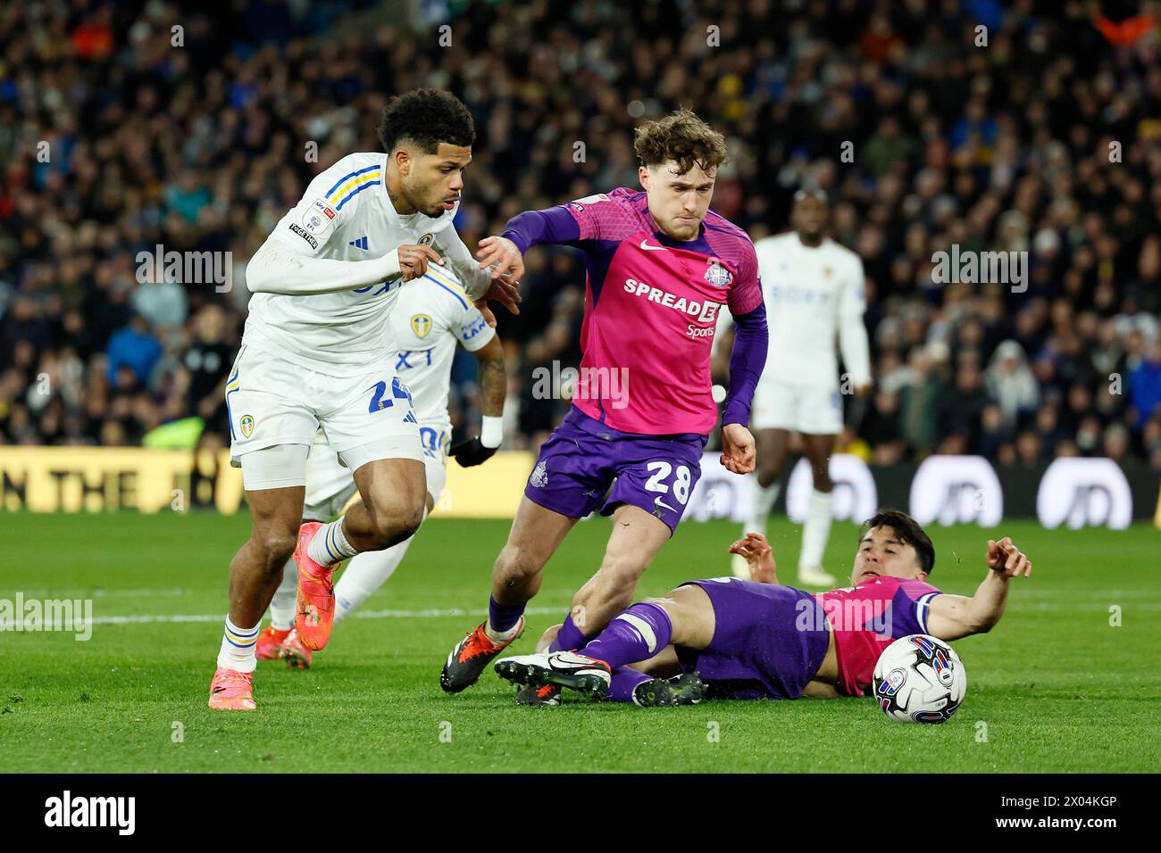 Leeds United's Georginio Rutter (left) evades a tackle from Sunderland ...