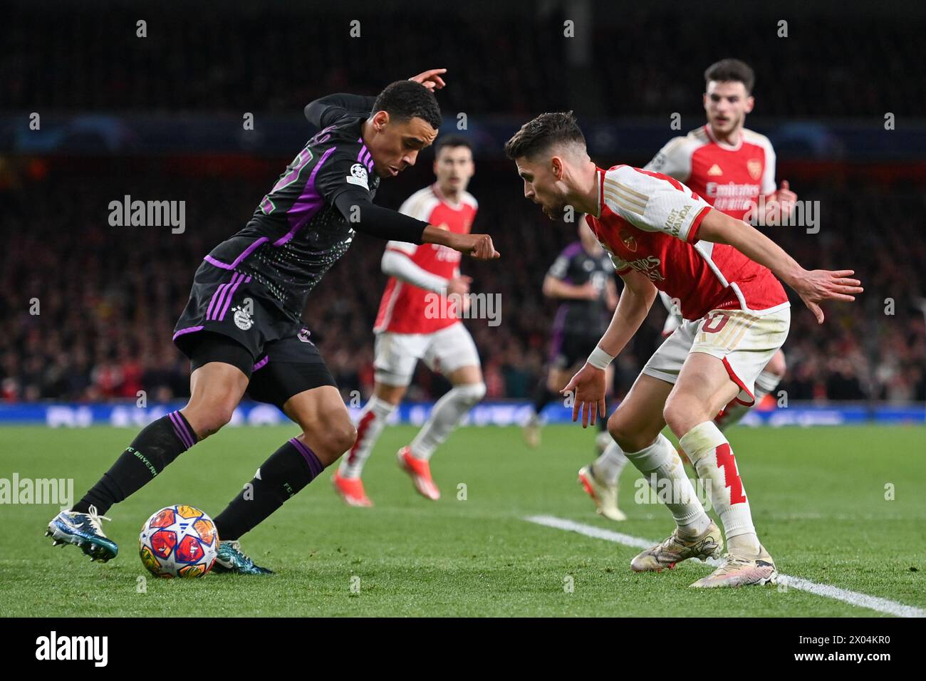 Jamal Musiala of Bayern Munich battles for possession with Jorginho of ...