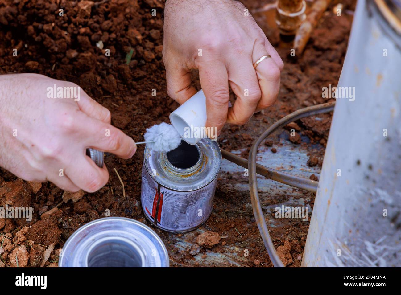 Plumbers use clear primer for PVC pipes before gluing them before ... Plumbers use clear primer for PVC pipes before gluing them before ...