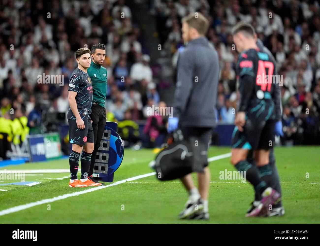 Manchester City's Julian Alvarez replaces Phil Foden (right), who walks ...