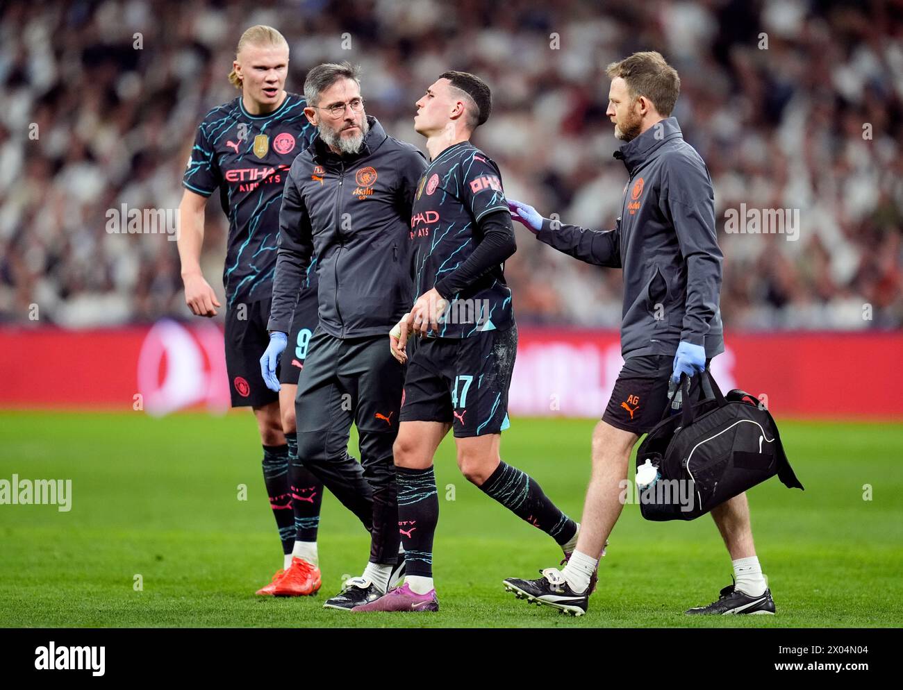 Manchester City's Phil Foden walks off injured during the UEFA ...