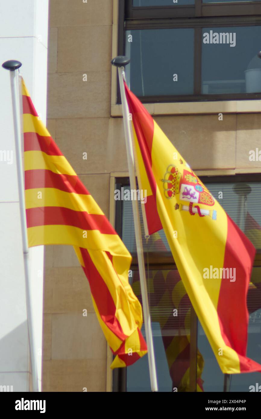 The Spanish national flag and the Catalan Senyera wave side by side ...