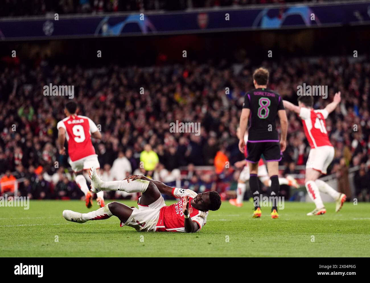 Arsenal's Bukayo Saka reacts after a challenge from Bayern Munich ...