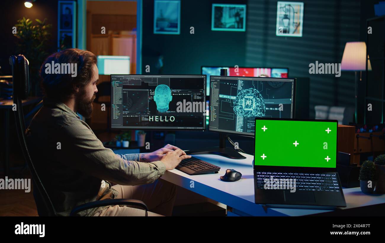 Engineer with EEG headset on programming brain transfer into computer ...