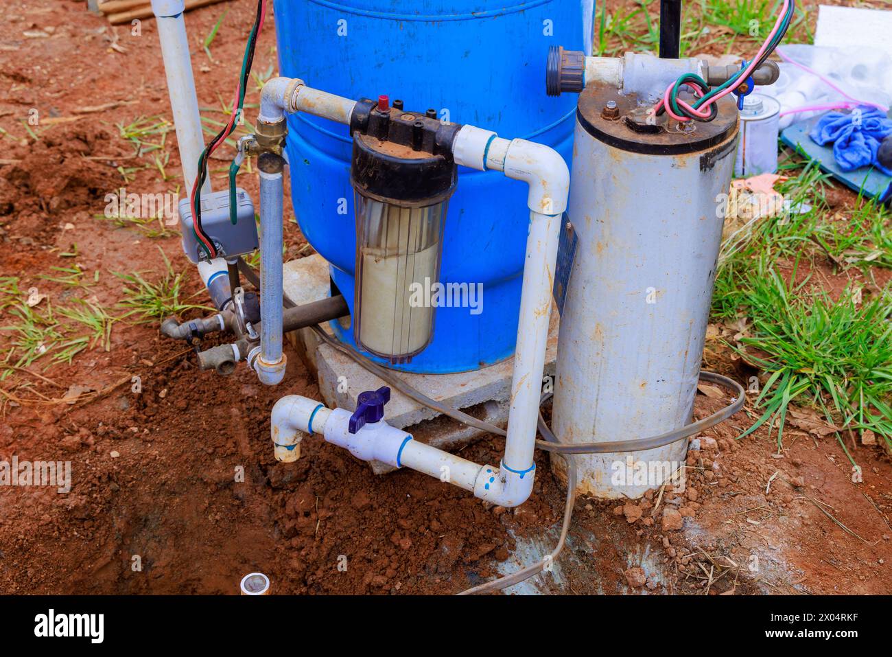 Plumber connects water to well pump with an underground pipeline for ...