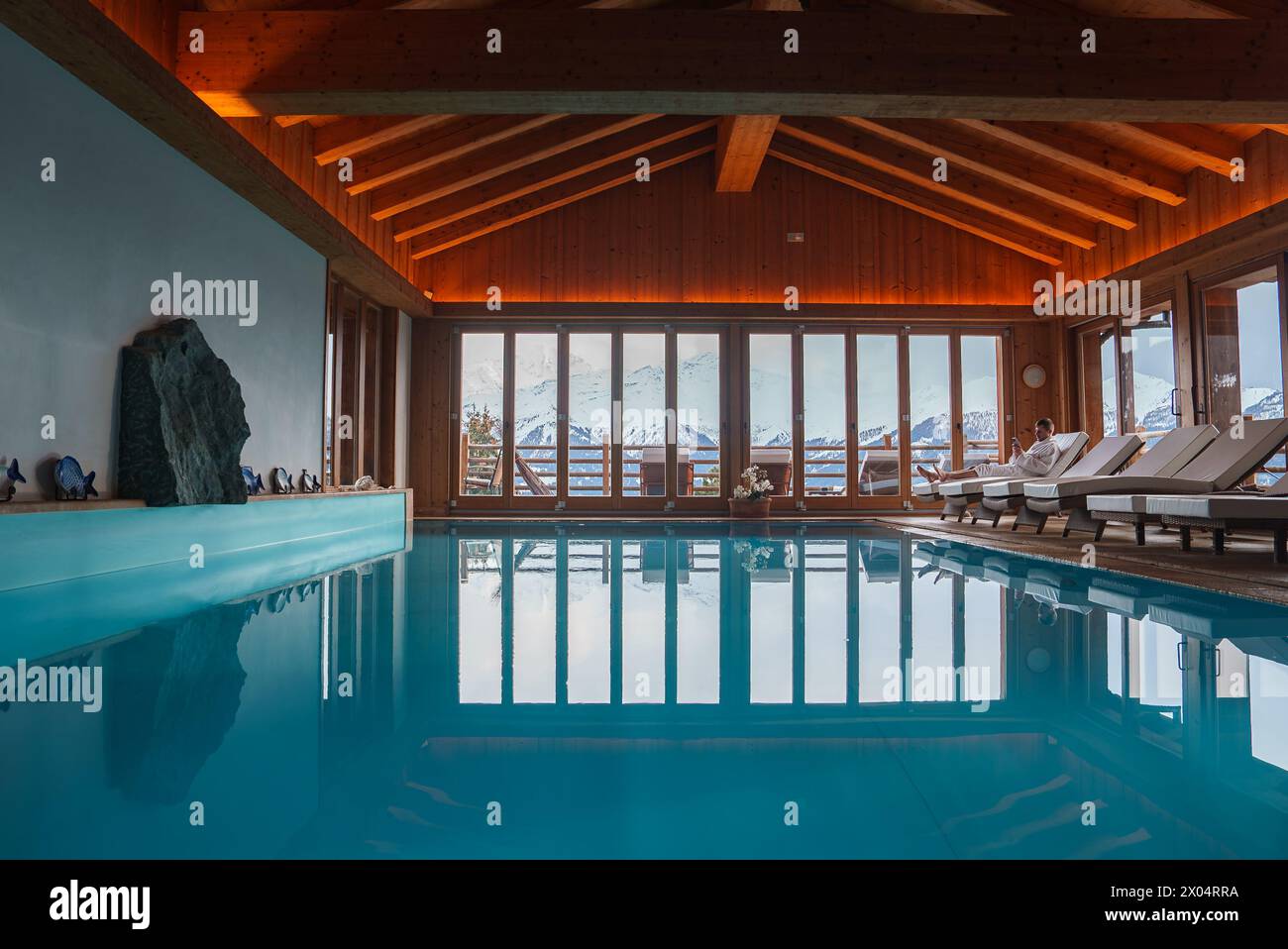 Luxurious Indoor Swimming Pool with Mountain Views Stock Photo - Alamy
