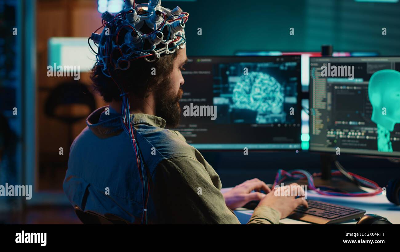 Computer scientist researching brain machine transferring, conducting ...