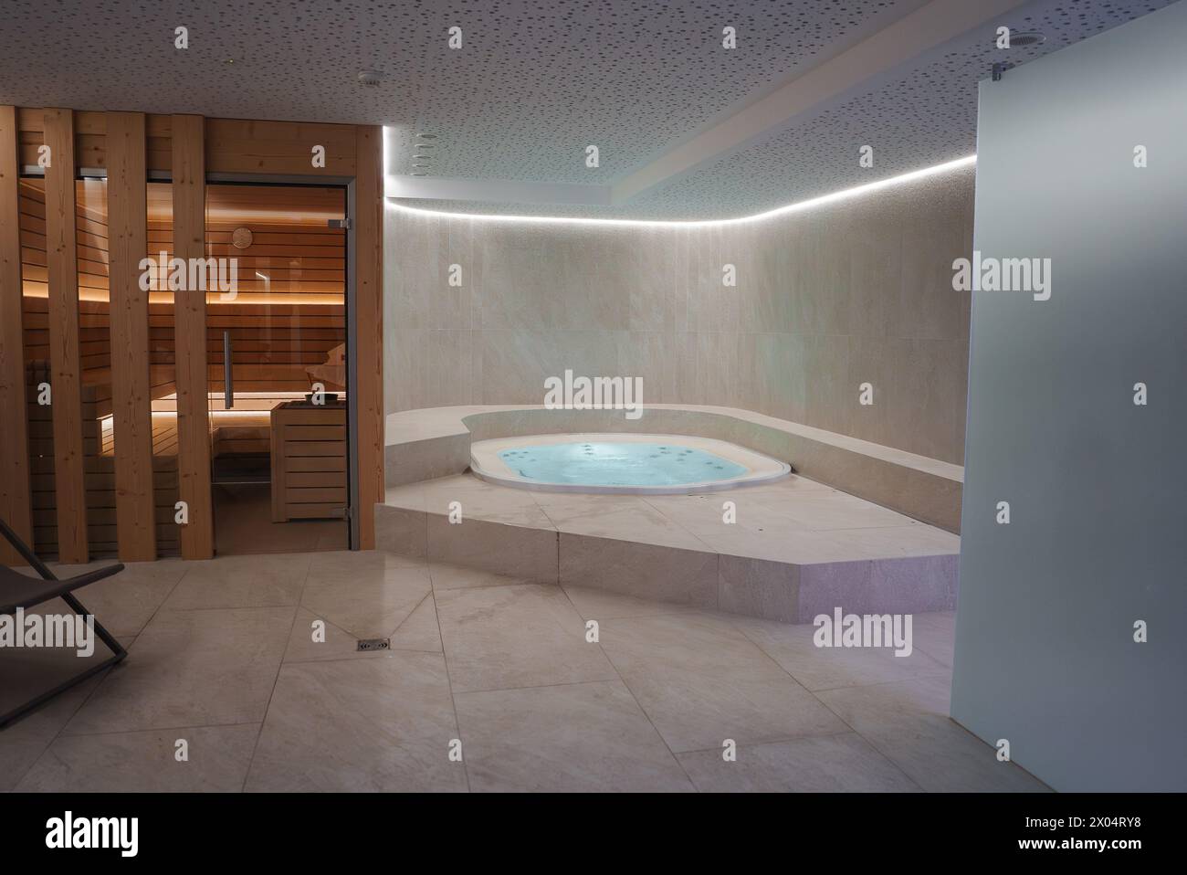 Modern Spa Interior with Sauna, Jacuzzi, and Lounge Chair Stock Photo ...