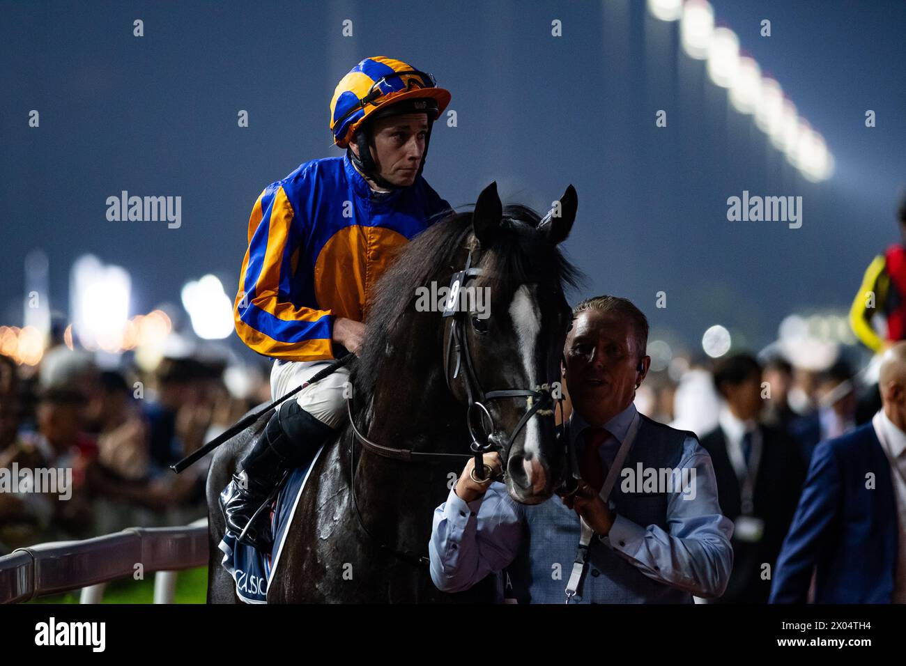 Auguste Rodin and jockey Ryan Moore head to the start for the Longines ...