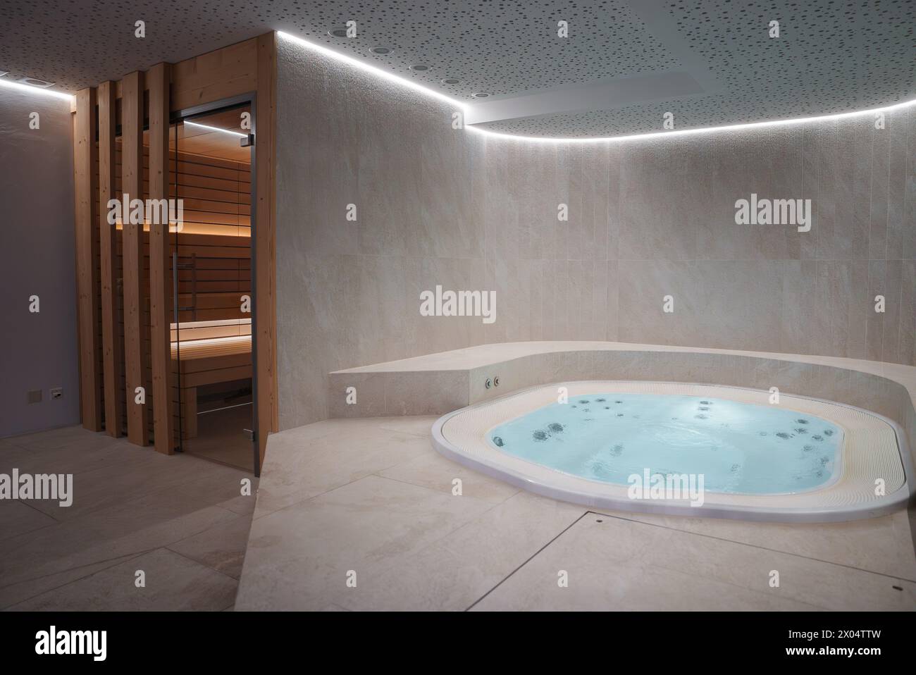 Luxurious Spa Area with Wooden Sauna, Jacuzzi, and Recessed Lighting ...
