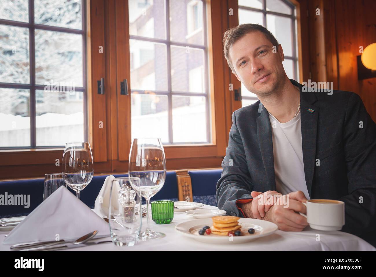 Luxury dining in cozy ski resort restaurant, Zermatt Stock Photo - Alamy