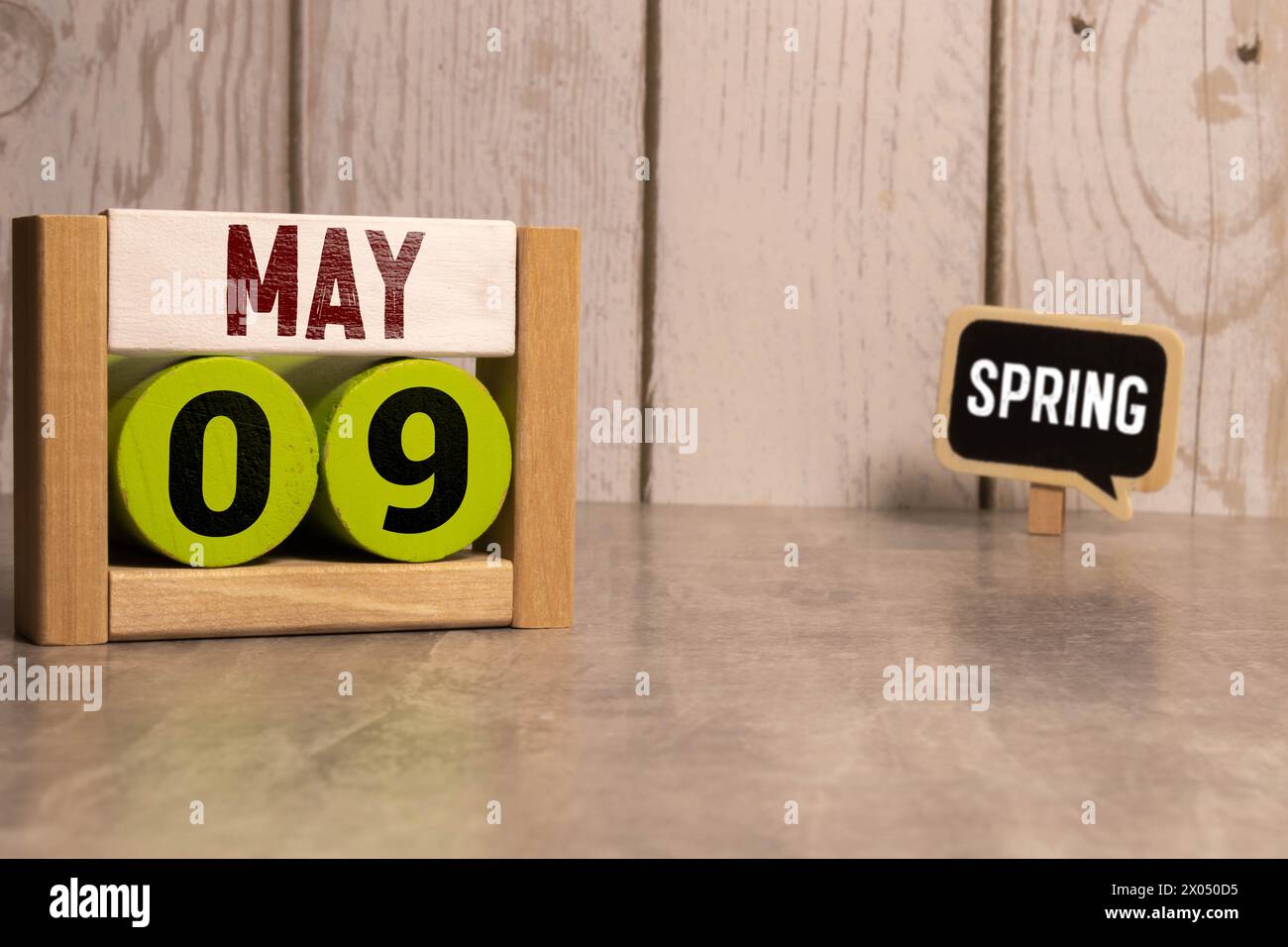 May 9 displayed wooden letter blocks on white background with space for ...
