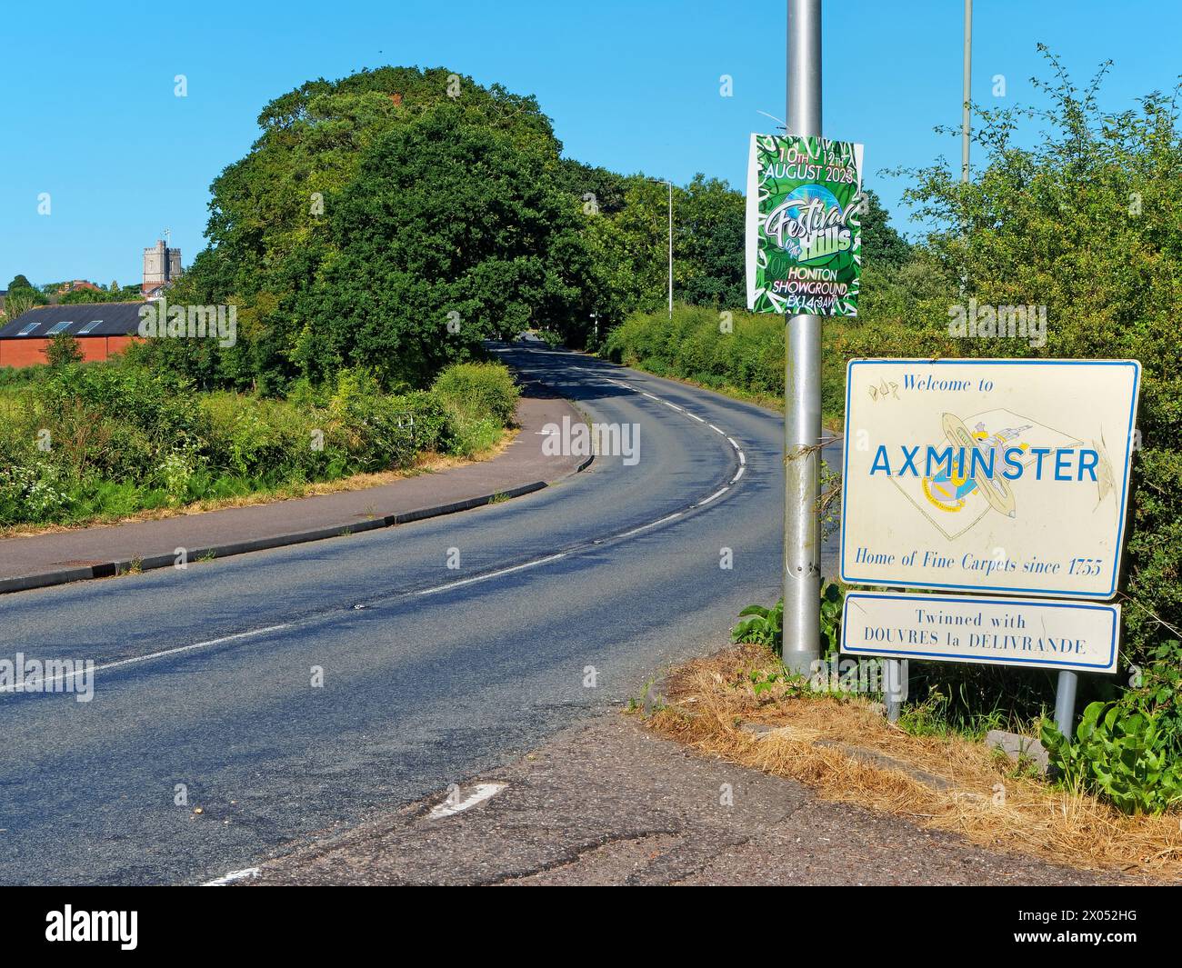 UK, Devon, Axminster, B3261 and Welcome to Axminster Sign with St Mary ...