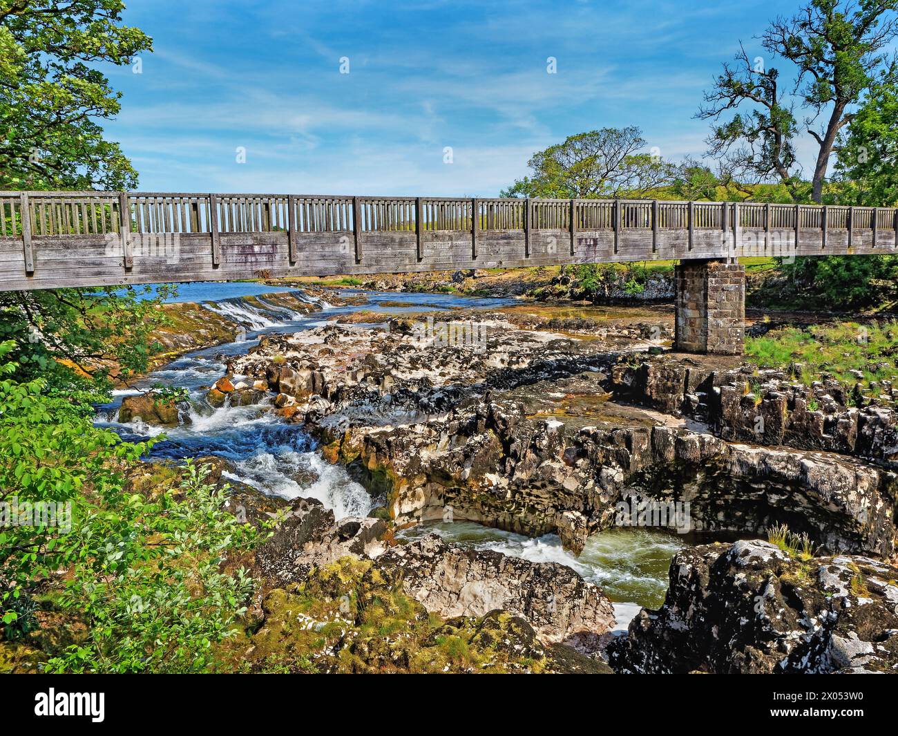 UK, North Yorkshire, Grassington, Tin Bridge over Linton Falls and ...