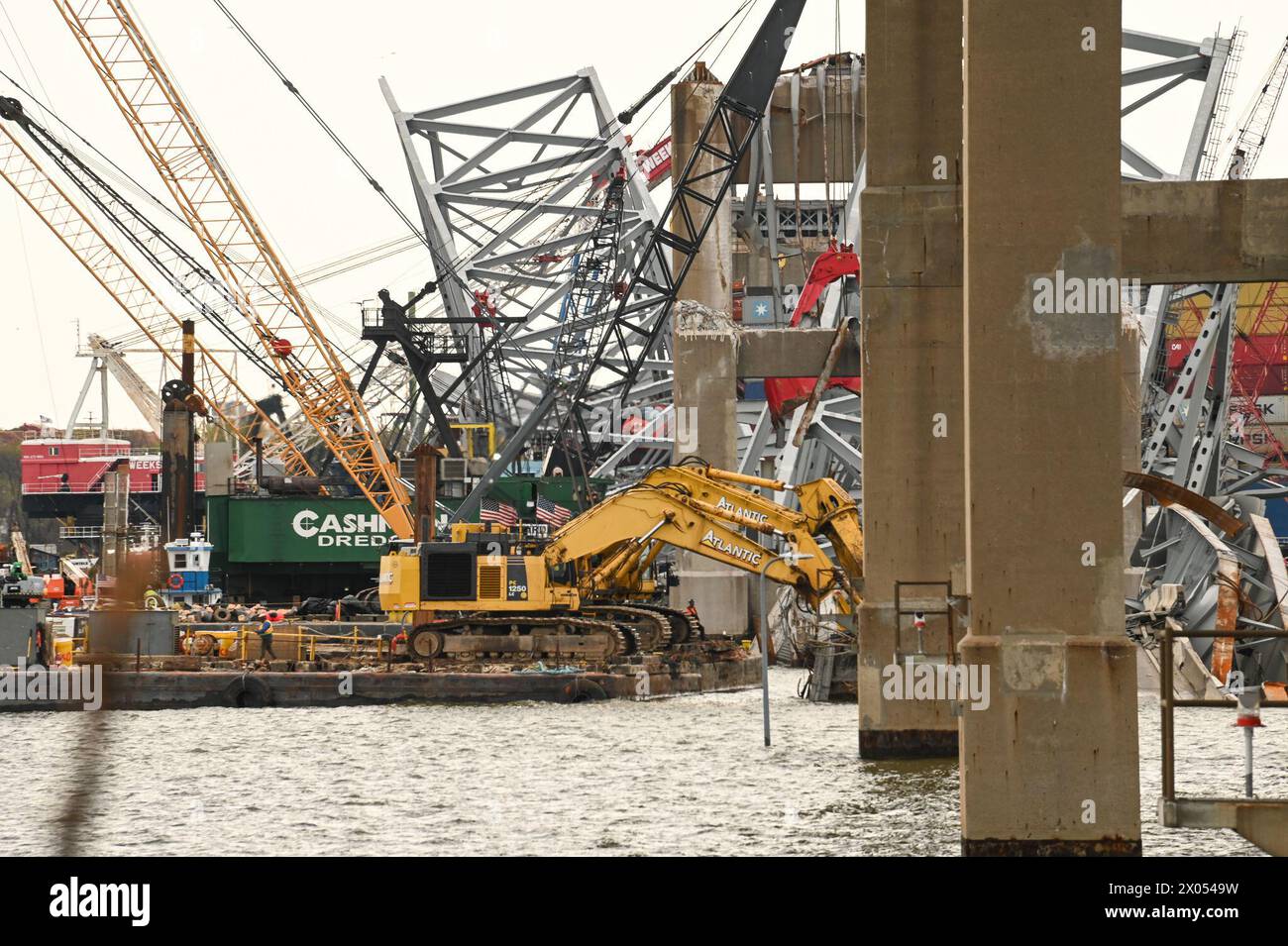Salvage crews from the Key Bridge Response Unified Command remove ...