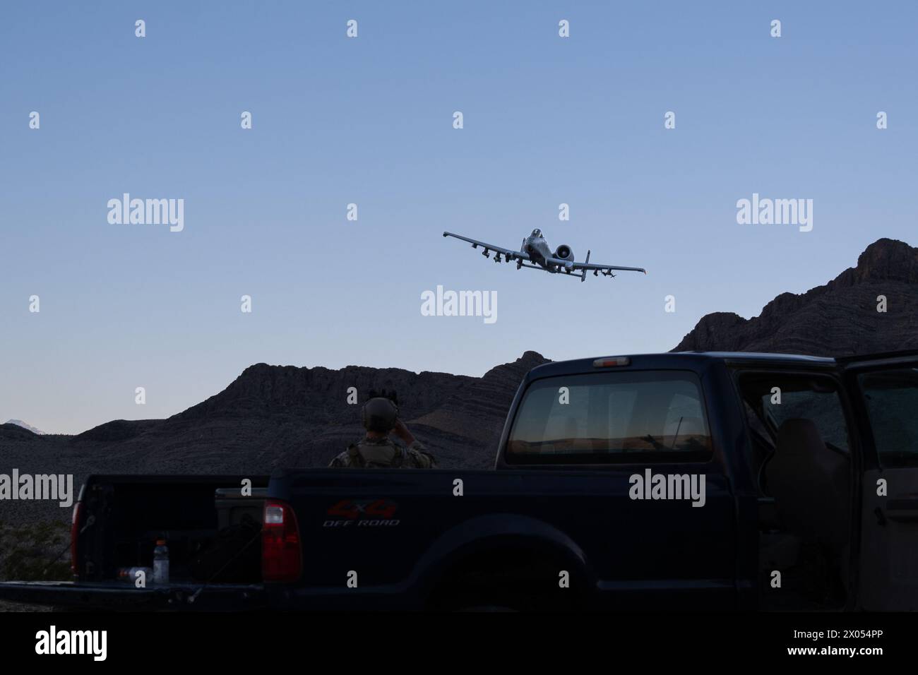 An A-10 Thunderbolt II conducts live-munition training and flies over ...