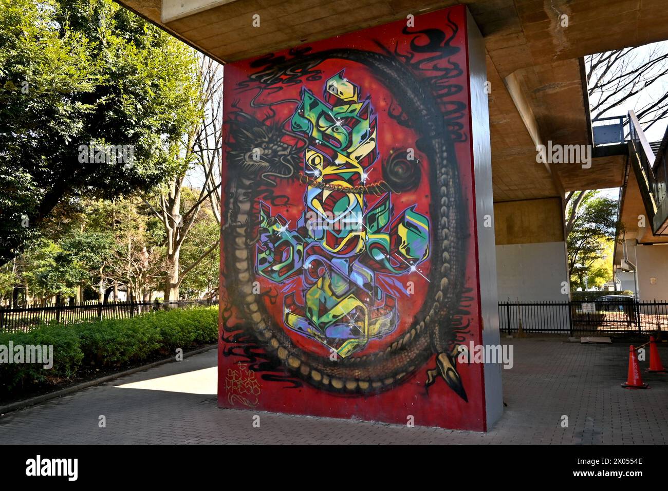 Red graffiti street art under the Shibuya Gate Observation Deck in ...
