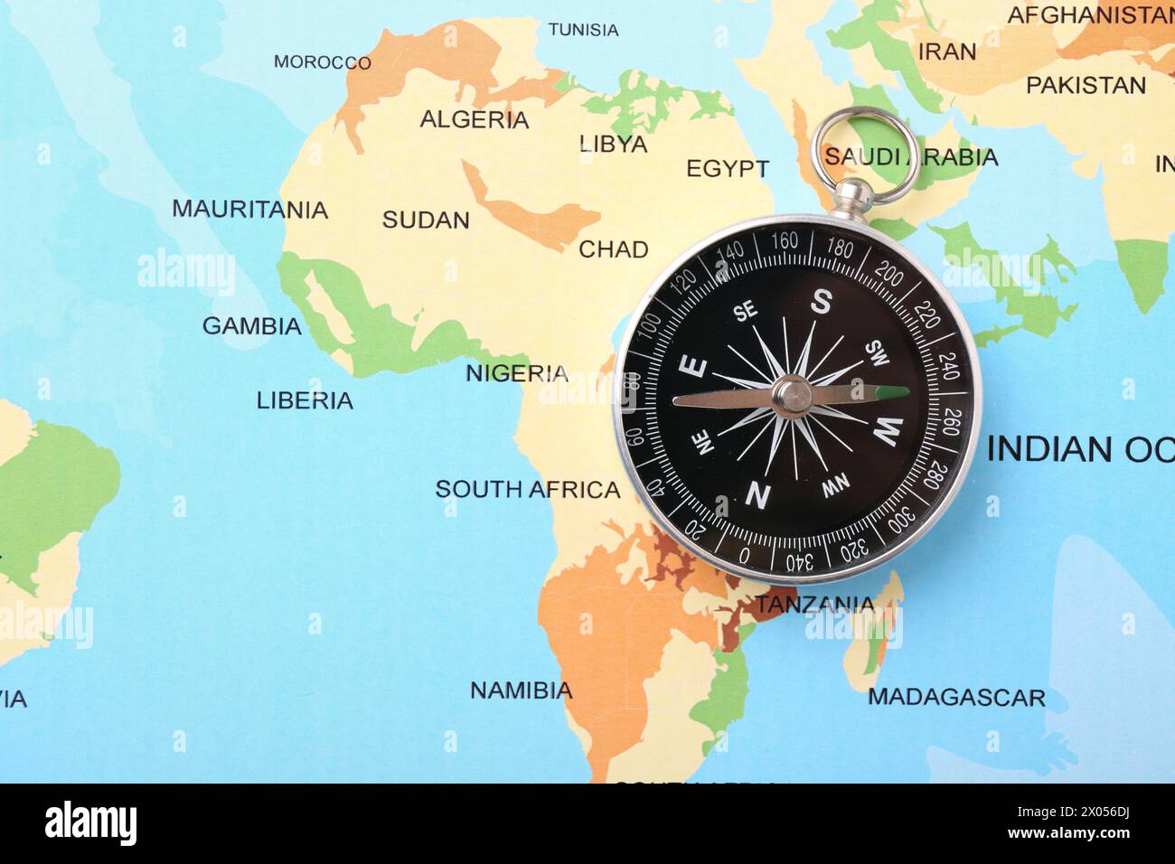 One compass on world map, top view. Space for text Stock Photo - Alamy