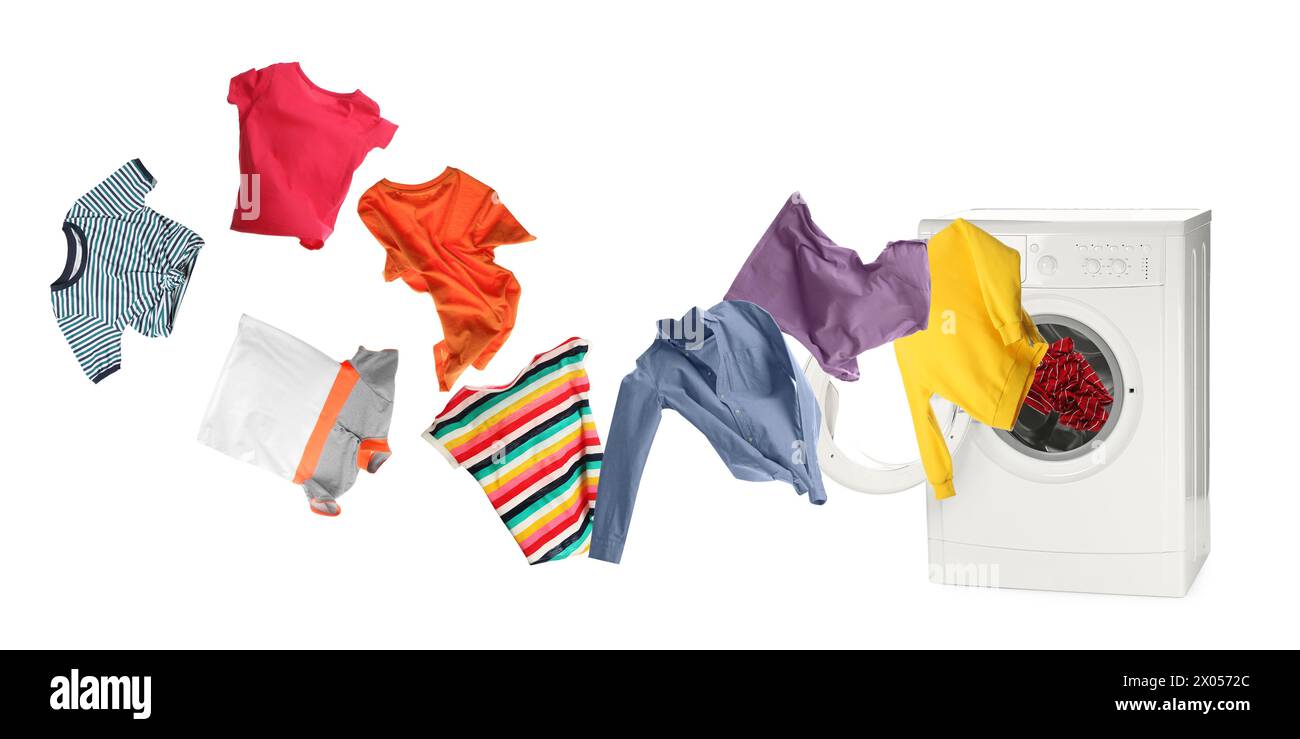 Washing machine and flying clothes on white background Stock Photo - Alamy
