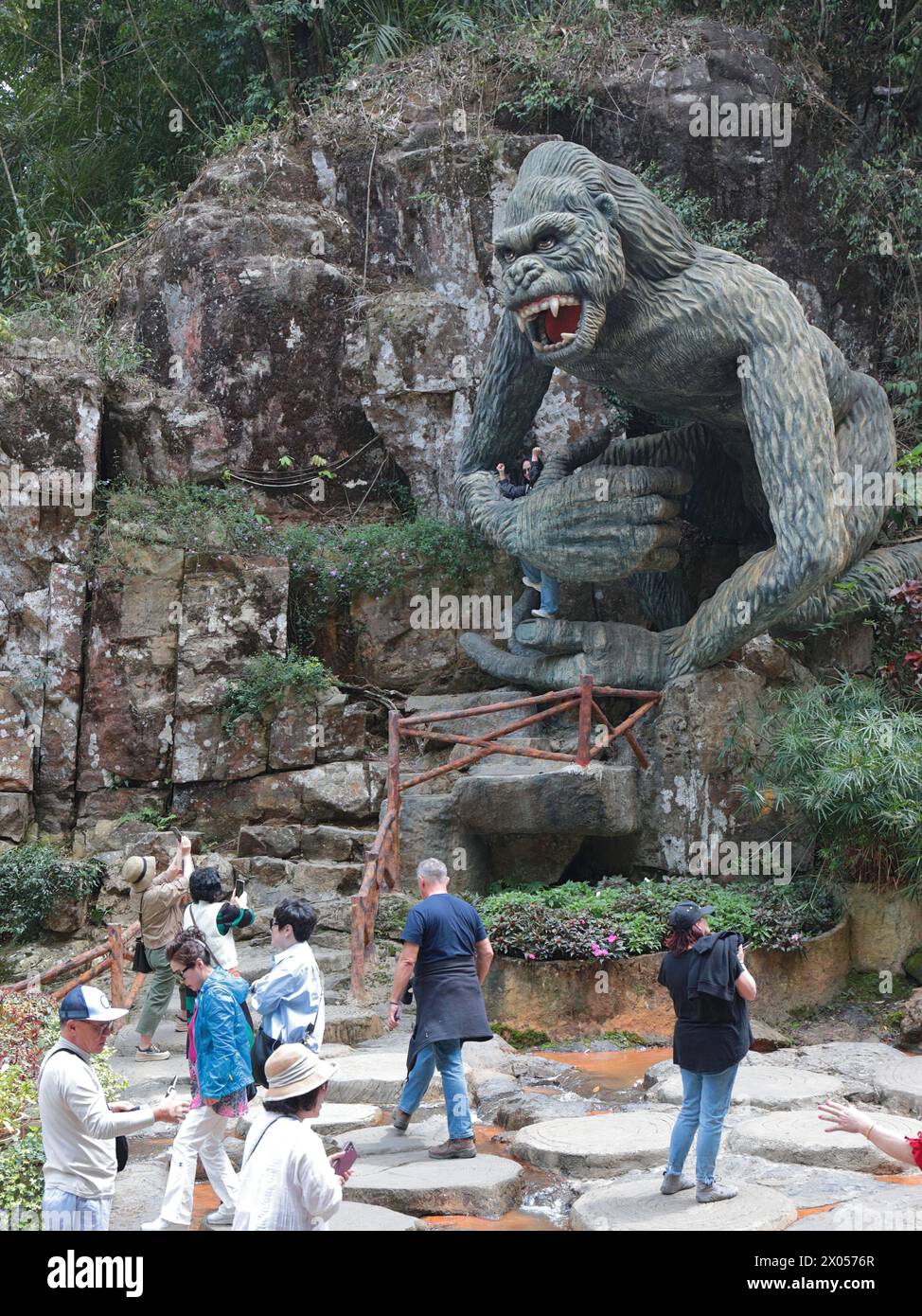 King Kong statue, with posing day-trippers, tourist site of Datanla ...