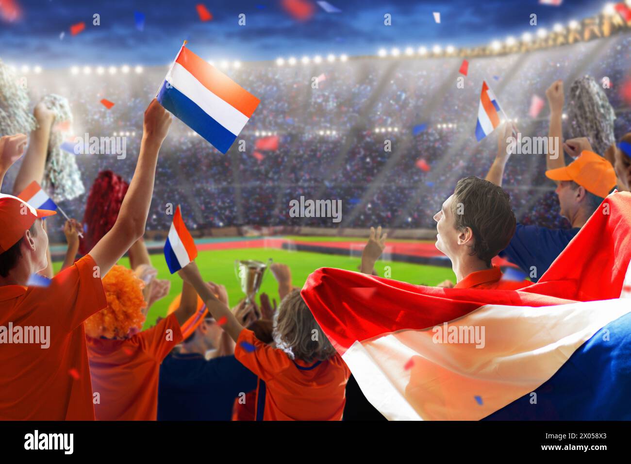 Netherlands football supporter on stadium. Dutch fans on soccer pitch ...