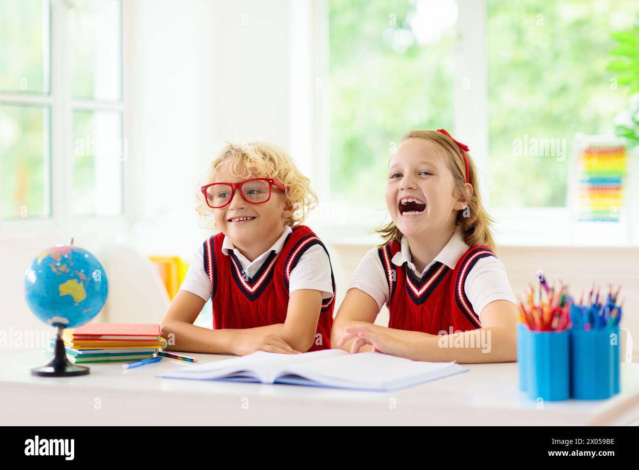 Kids go back to school. Children study and learn for preschool. Boy and ...