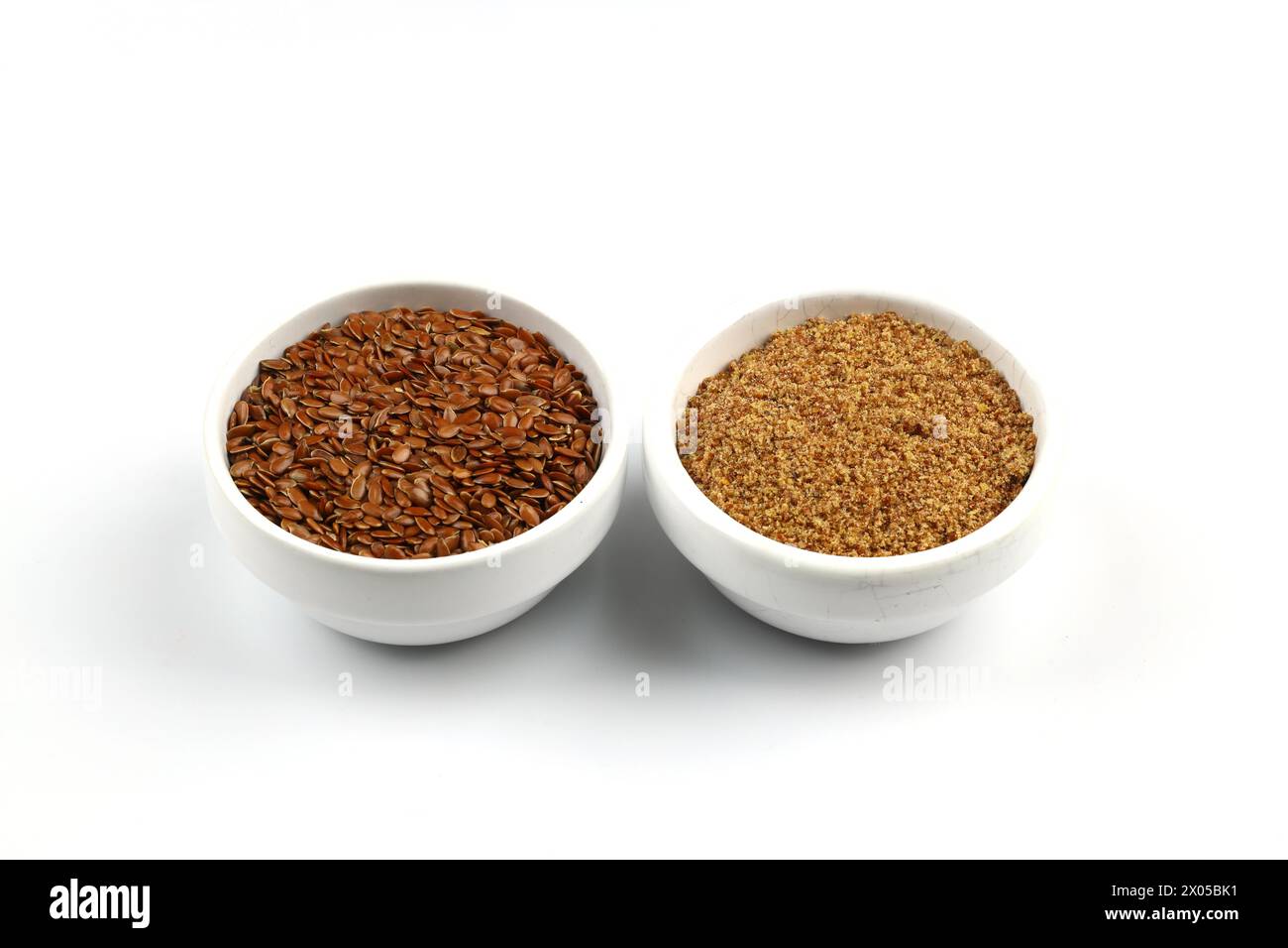 Pile of flax seeds isolated on white background Stock Photo - Alamy