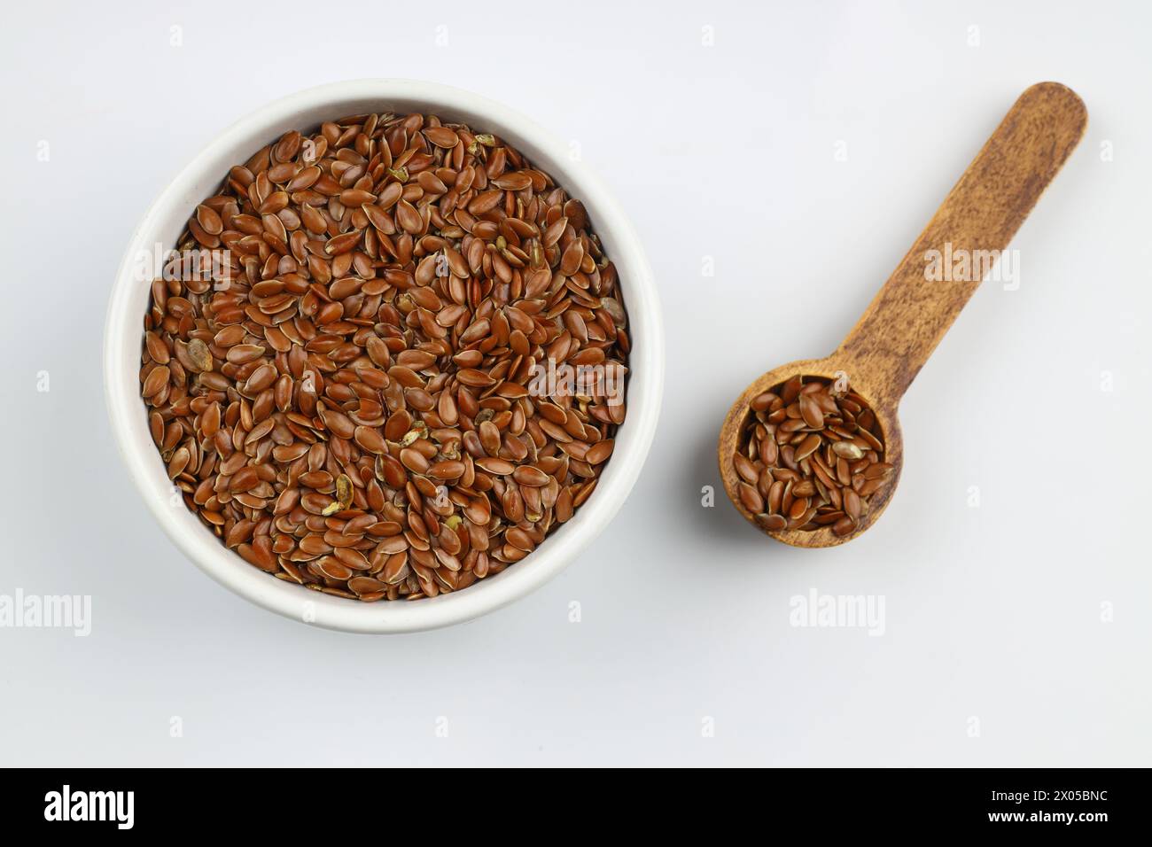 Pile of flax seeds isolated on white background Stock Photo - Alamy