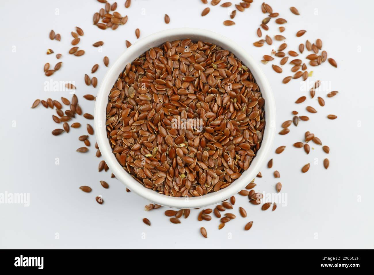 Pile of flax seeds isolated on white background Stock Photo - Alamy