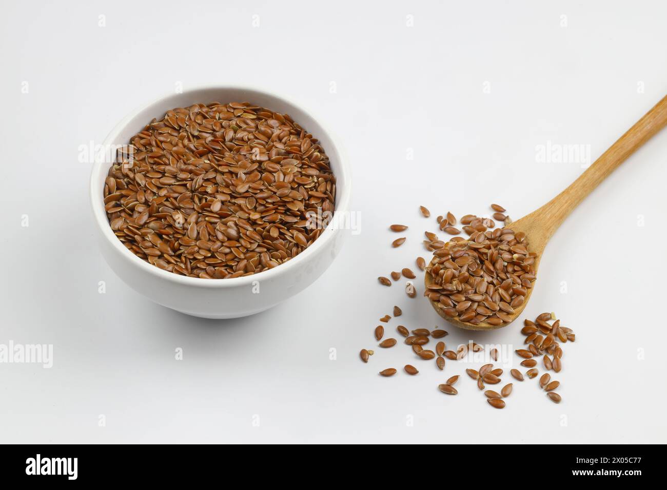 Pile of flax seeds isolated on white background Stock Photo - Alamy