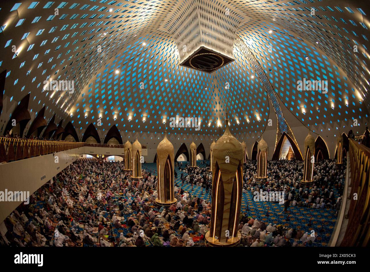 EID AL-FITR PRAYER IN BANDUNG Muslims sit waiting to perform Eid ...