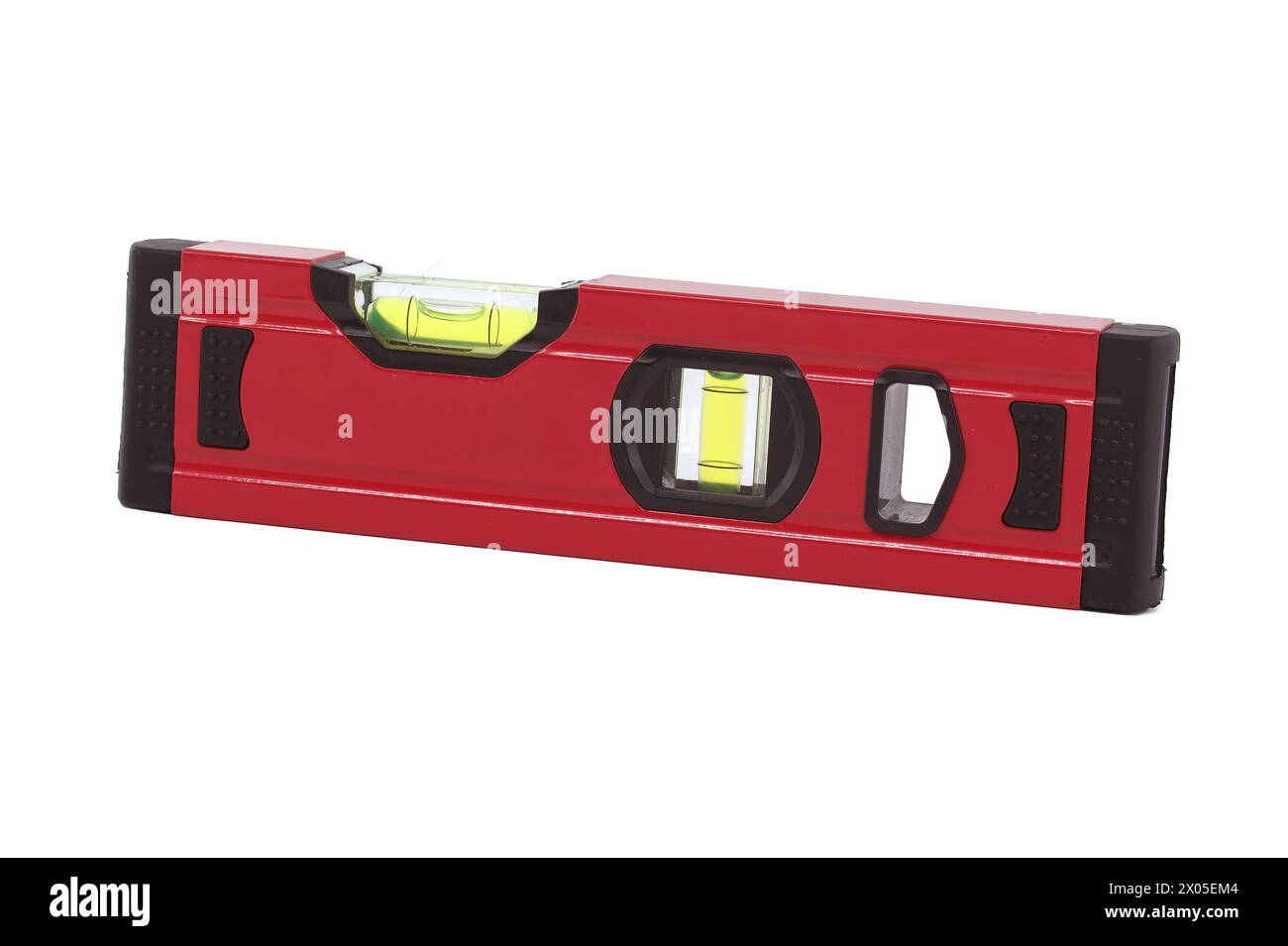 Red spirit level with a green bubble indicator is situated horizontally ...
