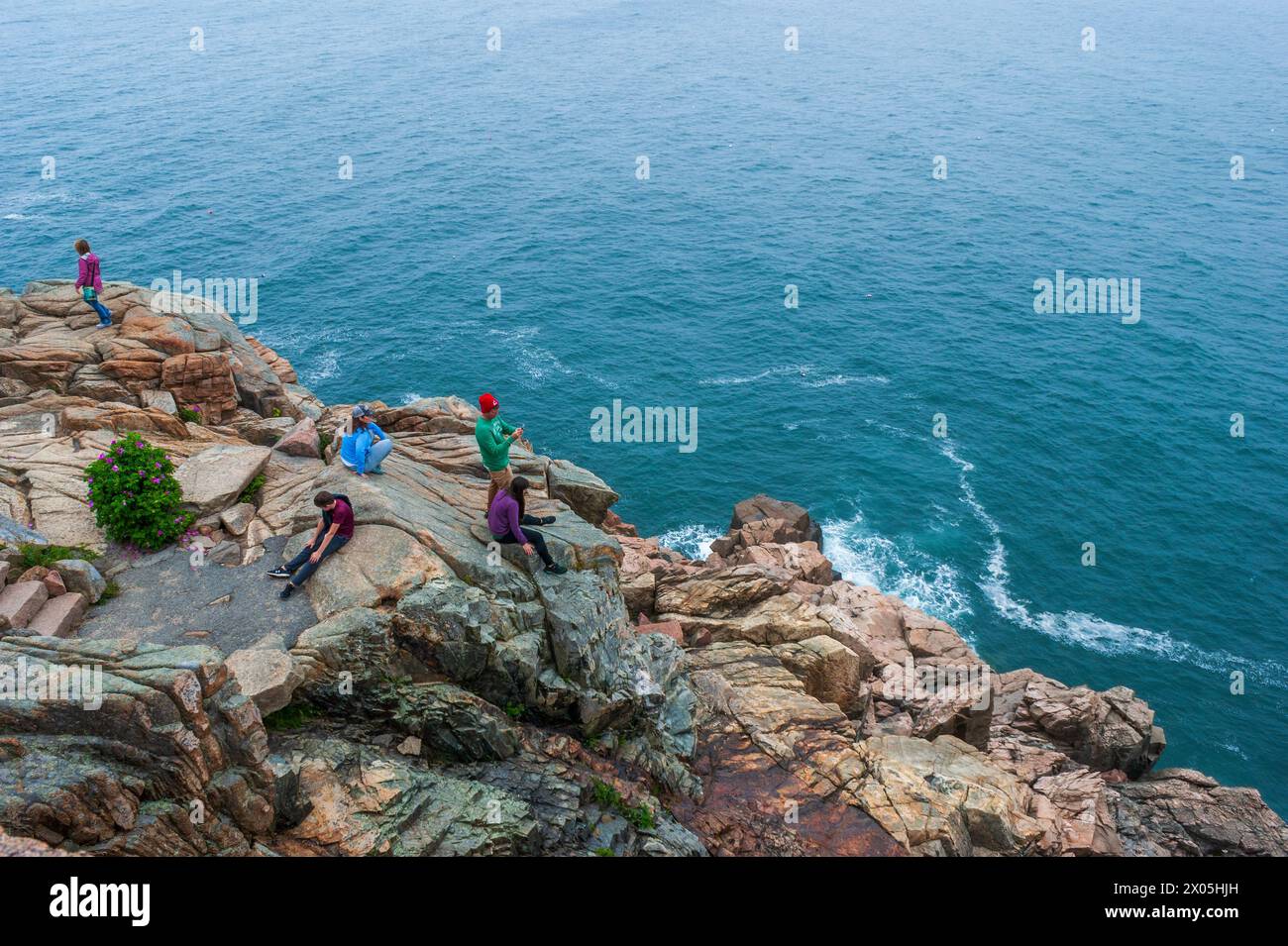 Visitors enjoying the stunning ocean views and rugged cliffs at Otter ...