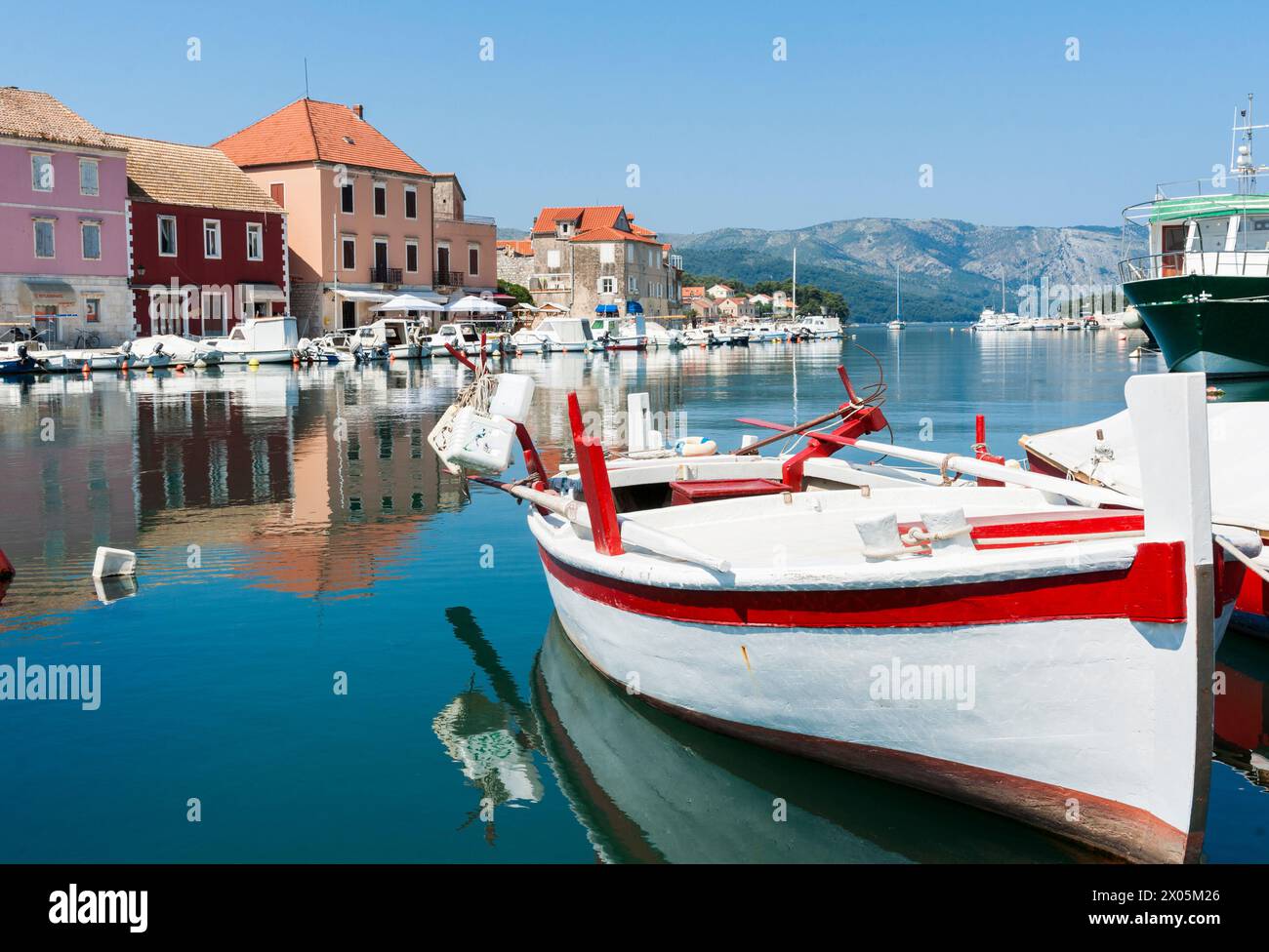 Stari grad waterfront with traditional boast around bay and buildings ...