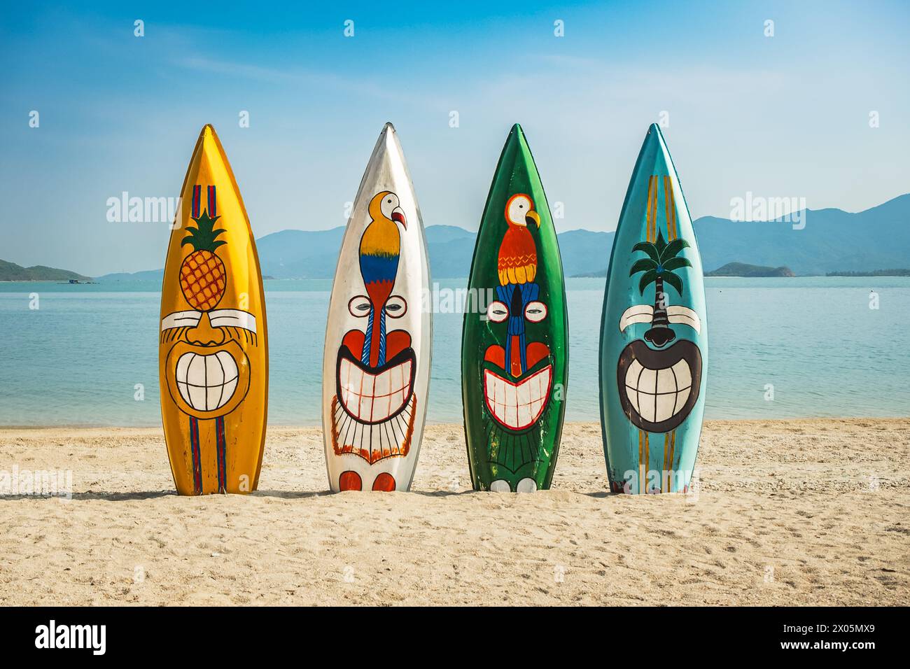 Surf board in the sand at the beach. Colorful surf board on the beach ...