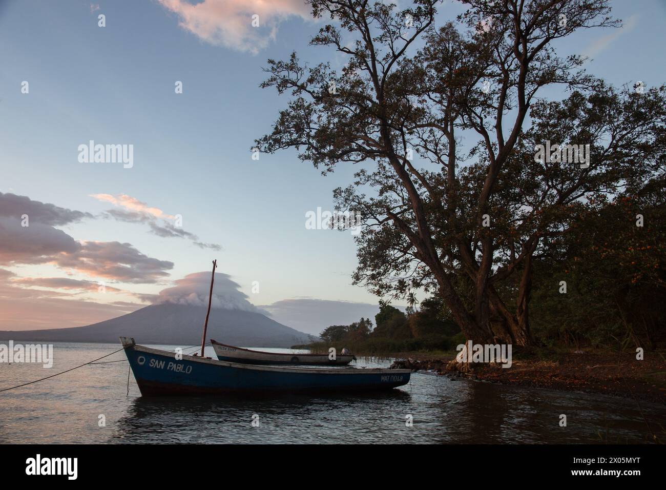 Sunset across Lake NIcaragua casts sunlight across the island of ...