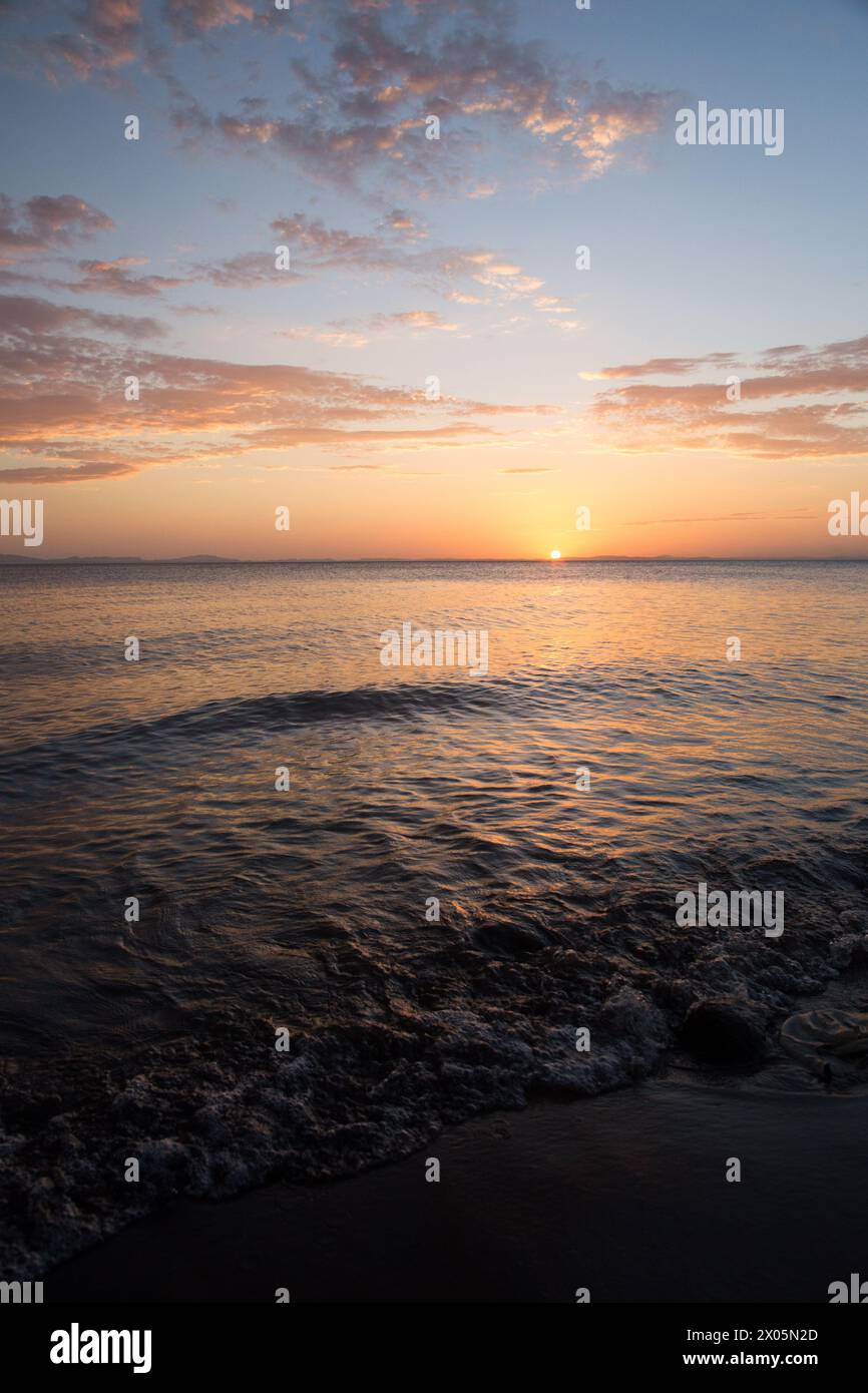 Sunset across Lake NIcaragua casts sunlight across the island of ...