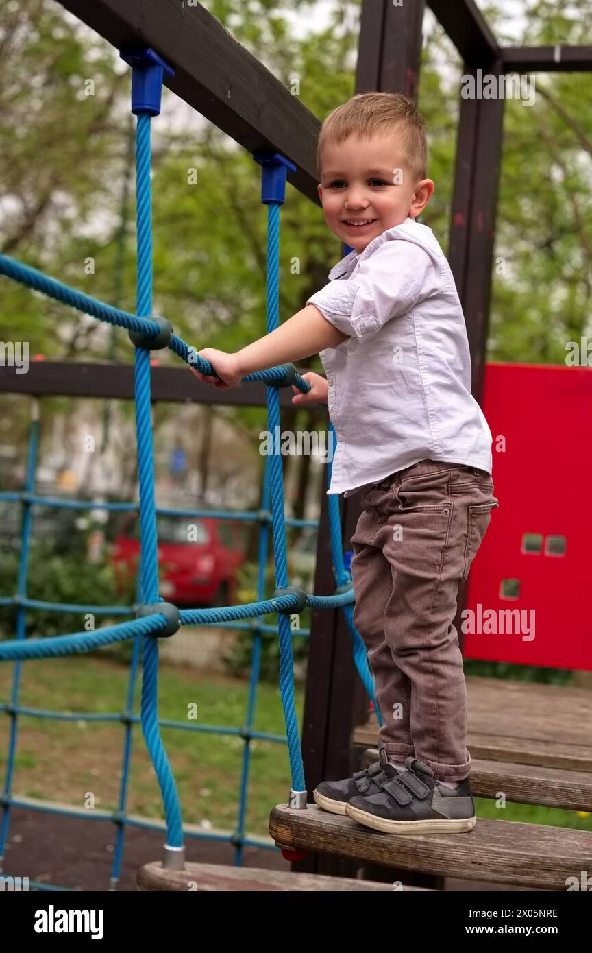 Little toddler on playground ladder Stock Photo - Alamy