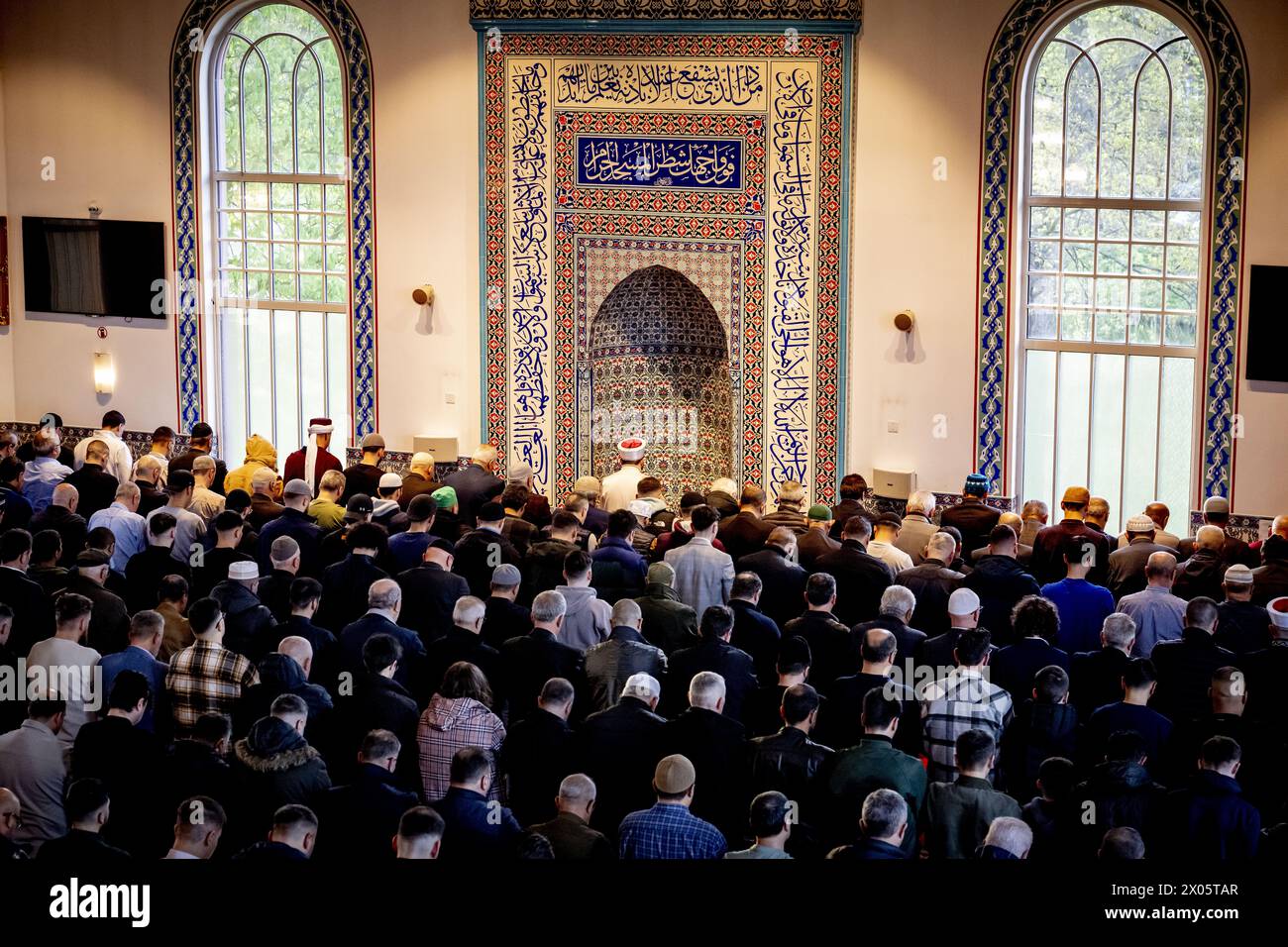 ROTTERDAM - Muslims during morning prayers in the Mevlana Mosque. Eid ...