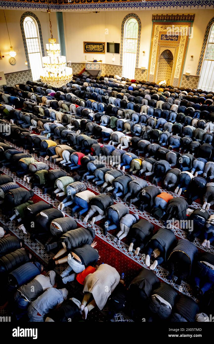 ROTTERDAM - Muslims during morning prayers in the Mevlana Mosque. Eid ...