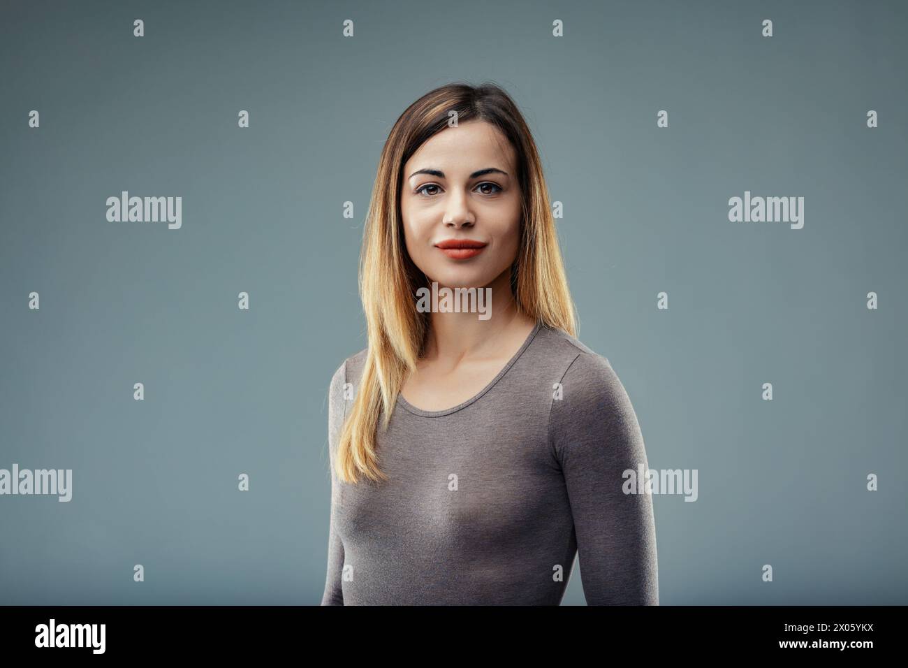 Displaying an understated confidence, her serene facial expression ...