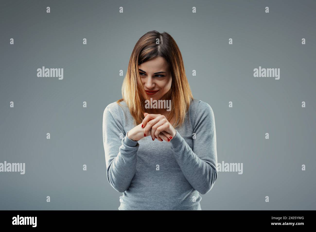 woman's sly grin hints at a clever plot brewing, playful mischief in ...