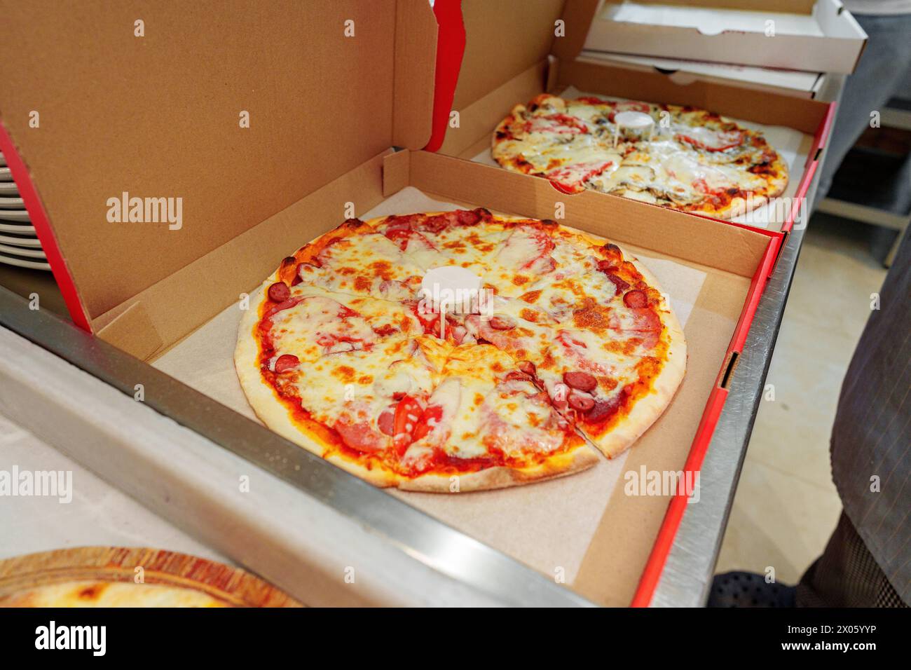 Two Freshly Baked Pizzas in Open Cardboard Boxes Ready for Delivery ...