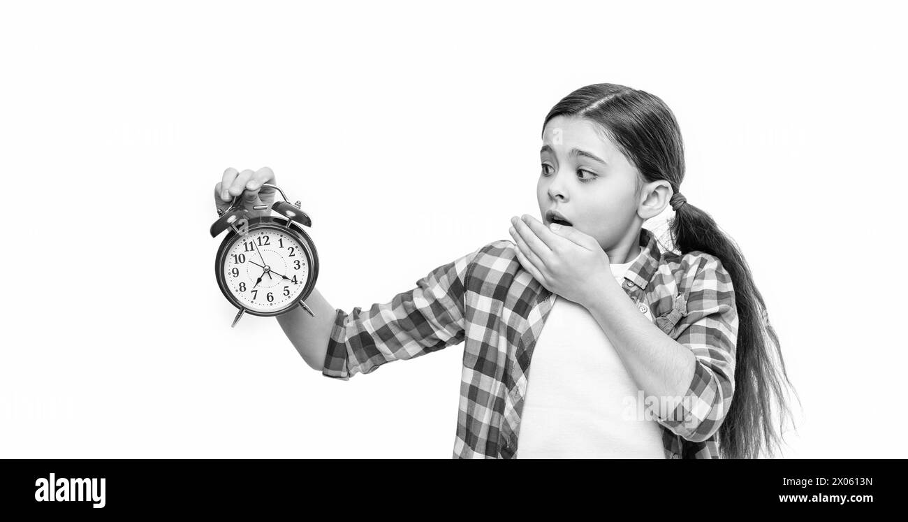 shocked punctual teen girl with alarm on background. photo of punctual ...